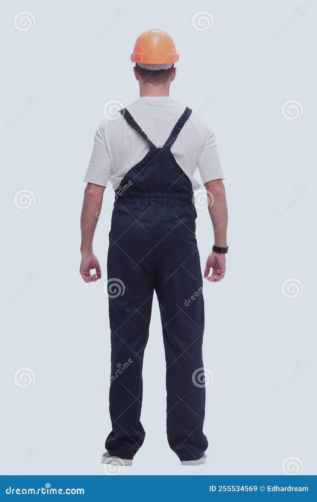 Rear View. a Man in a Work Suit Looking at a Copy of the Space Stock ...