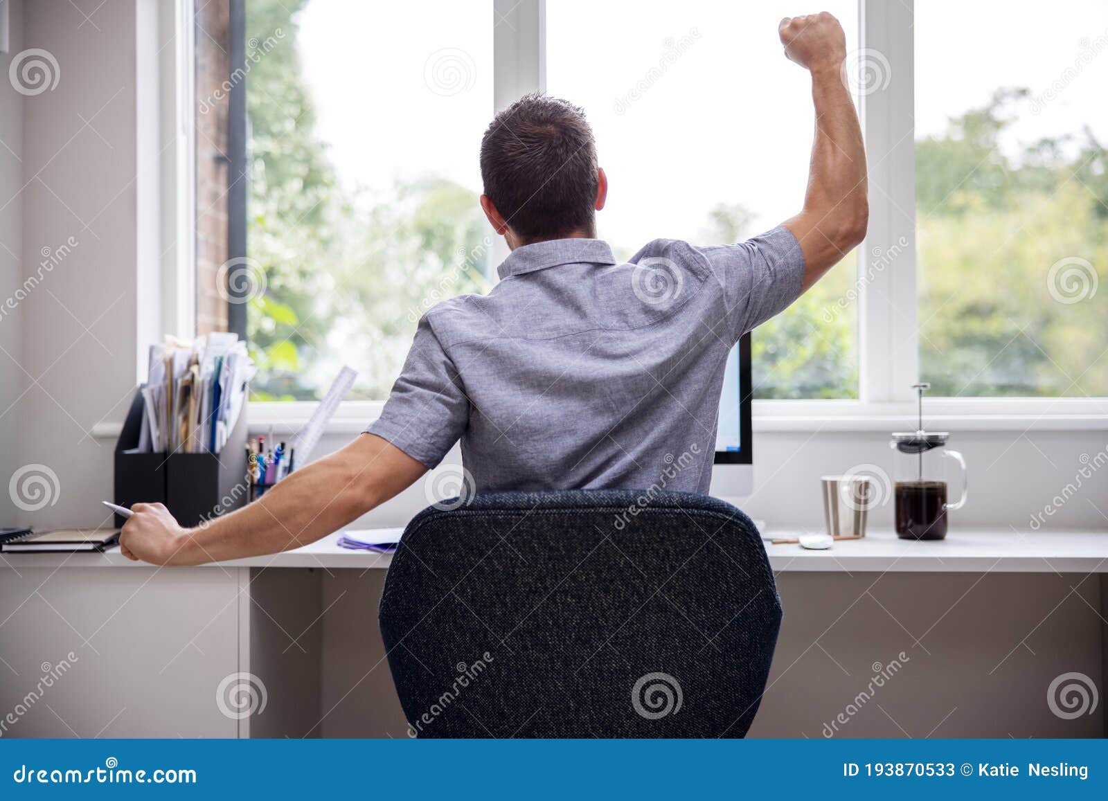 Rear View of Man Working from Home on Computer in Home Office ...