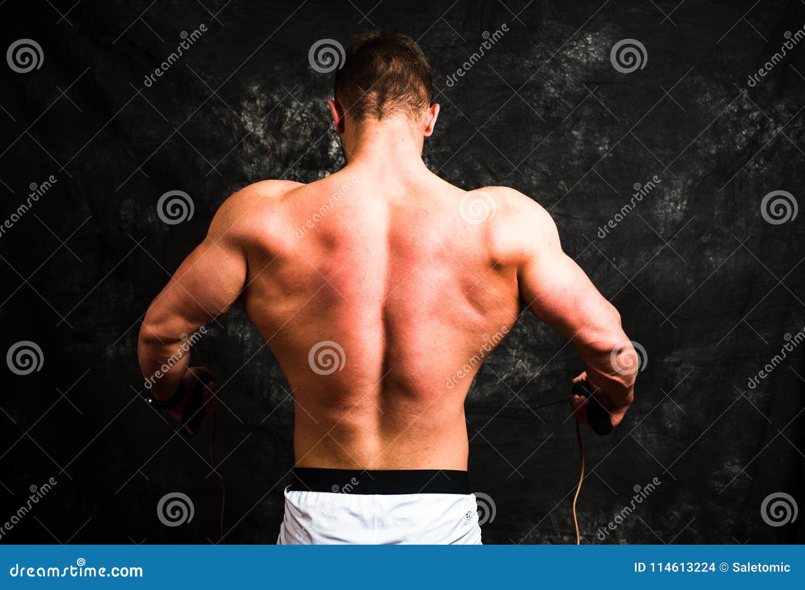 Rear View of Masculine Man Holding a Jumping Rope Stock Photo - Image ...