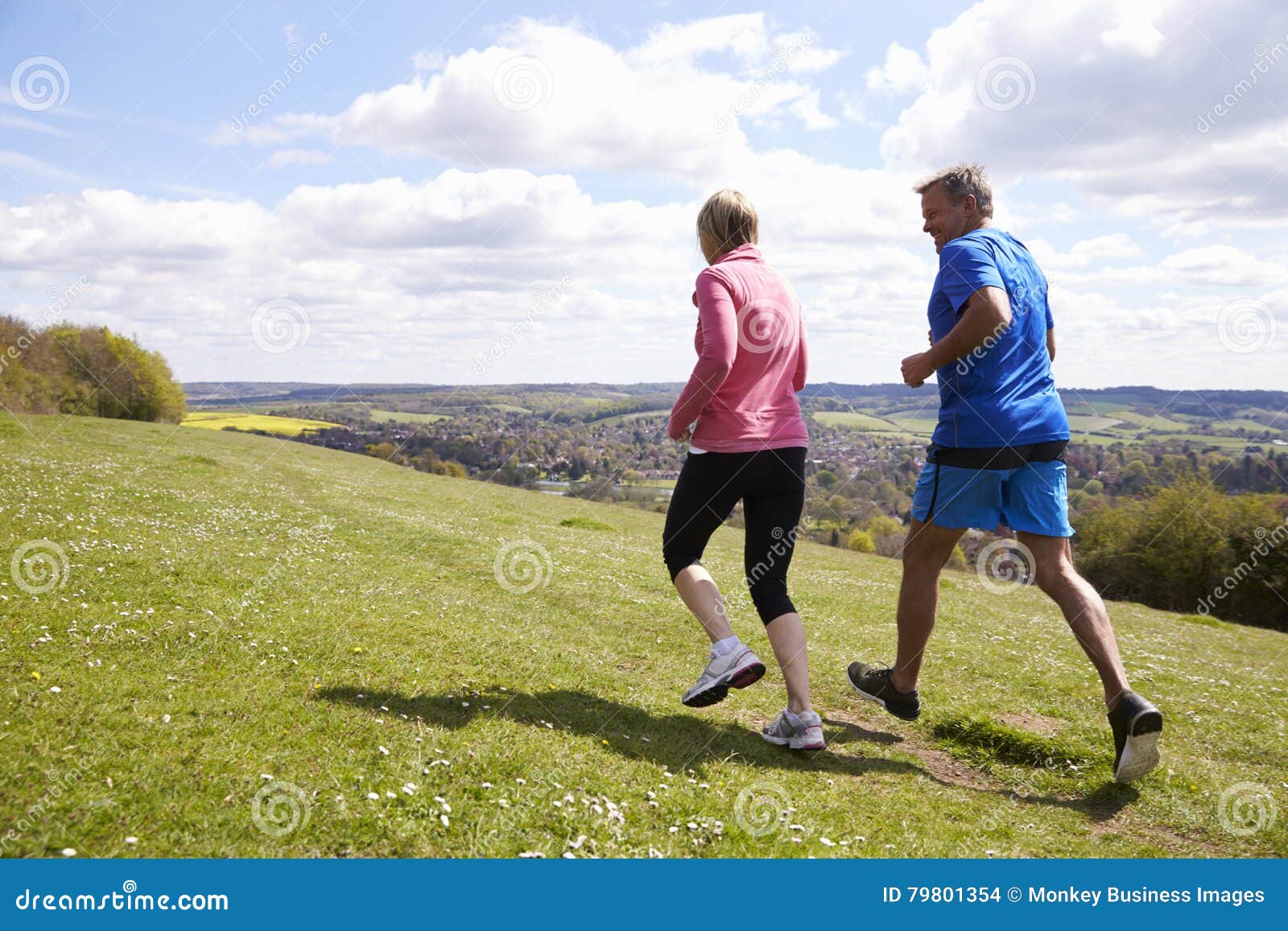 Rear View of Mature Couple Jogging in Countryside Stock Photo - Image ...