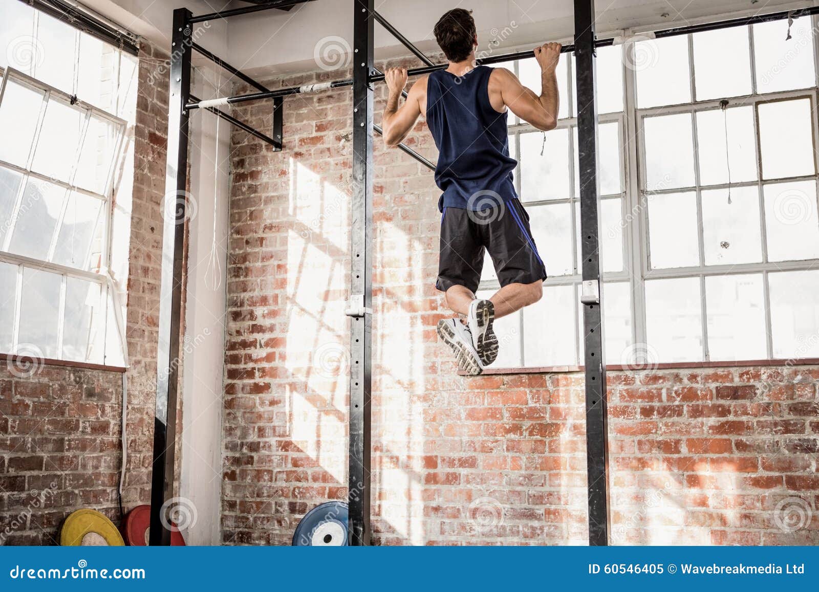 Rear View of Muscular Man Doing Pull Ups Stock Image - Image of room ...