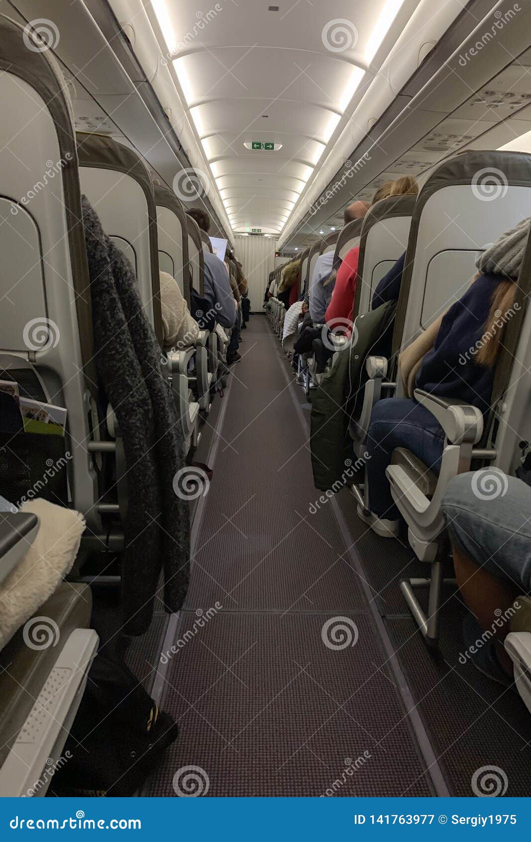 Rear View of People in a Passenger Plane Editorial Photography - Image ...