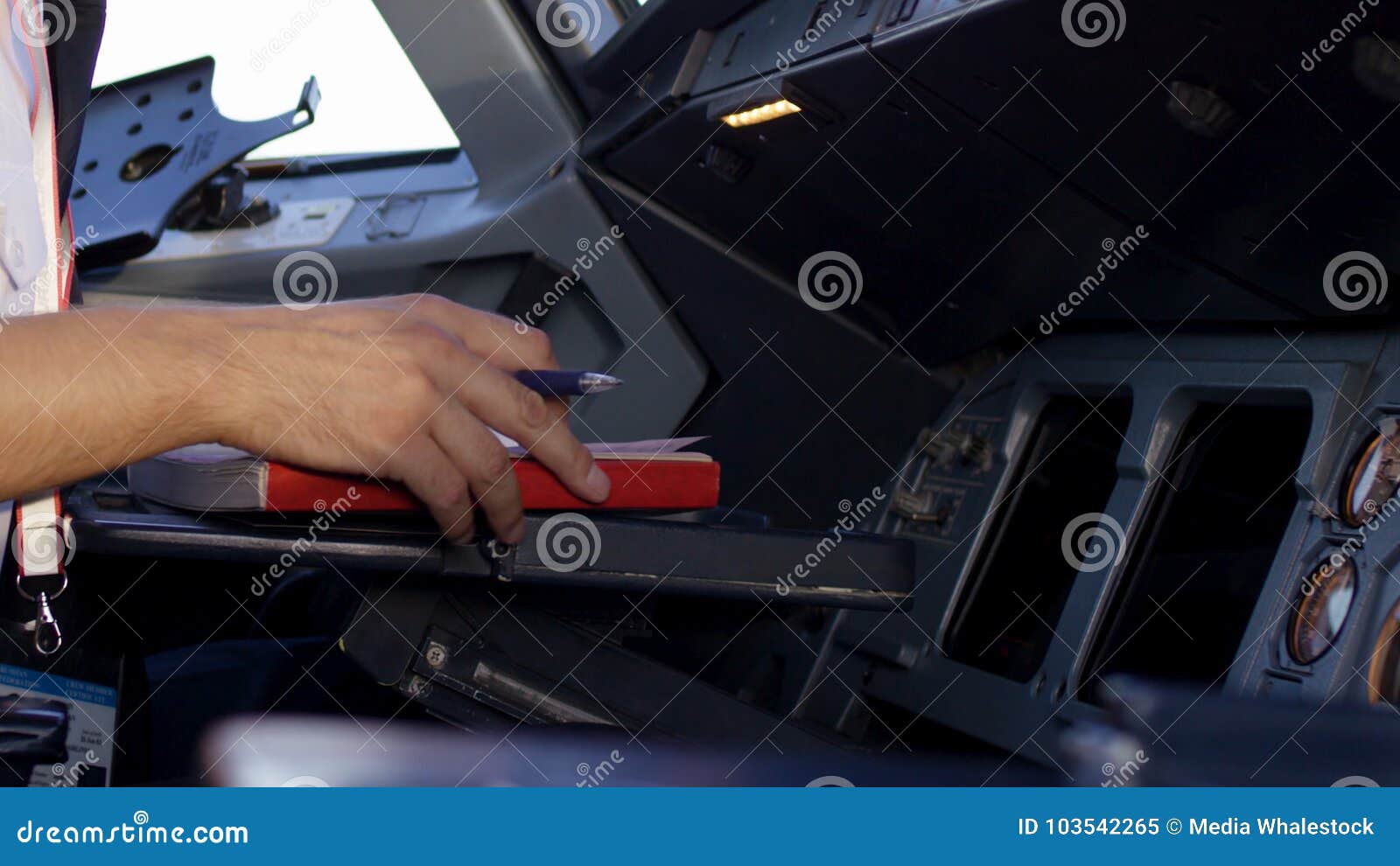 A Pilot Checking Instruments in a Plane Cockpit. Rear View of Pilot ...