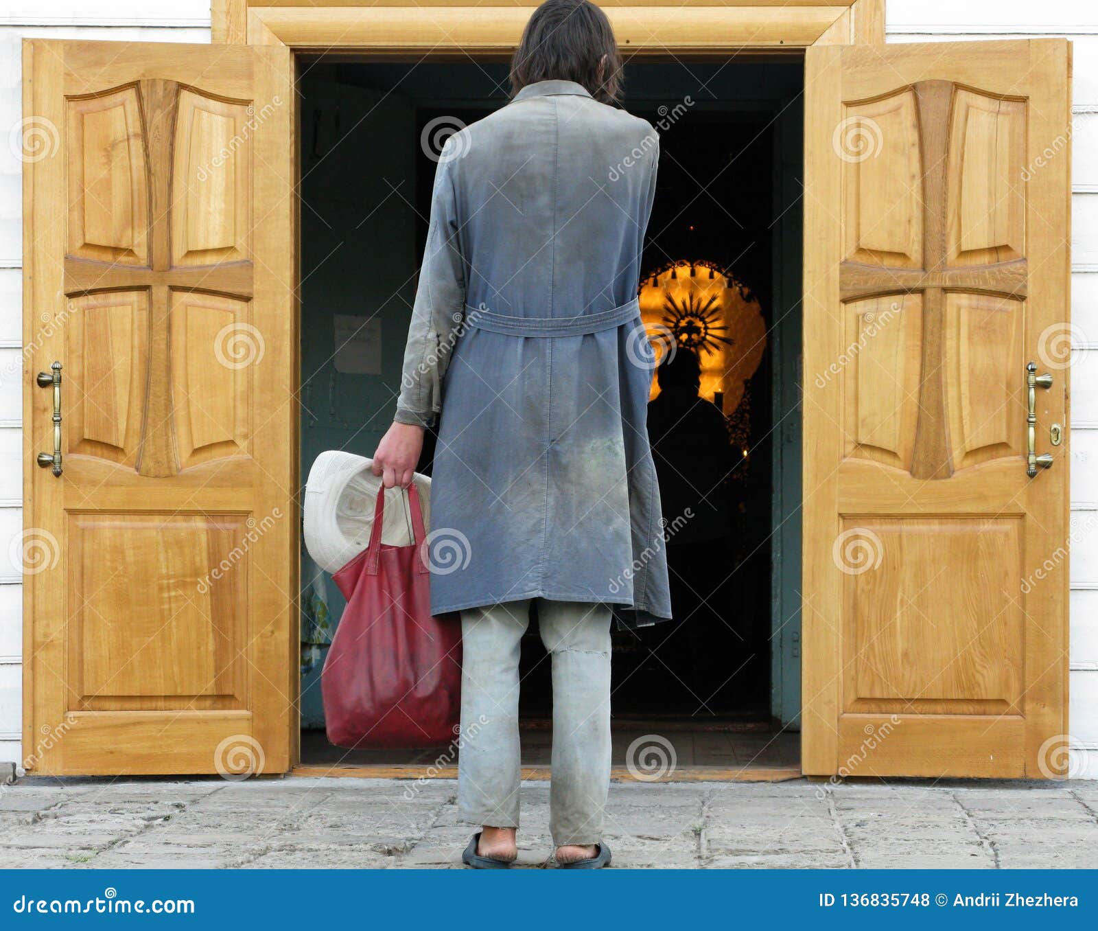 Rear View of a Poor Man Standing in Front of Open Church Doors ...