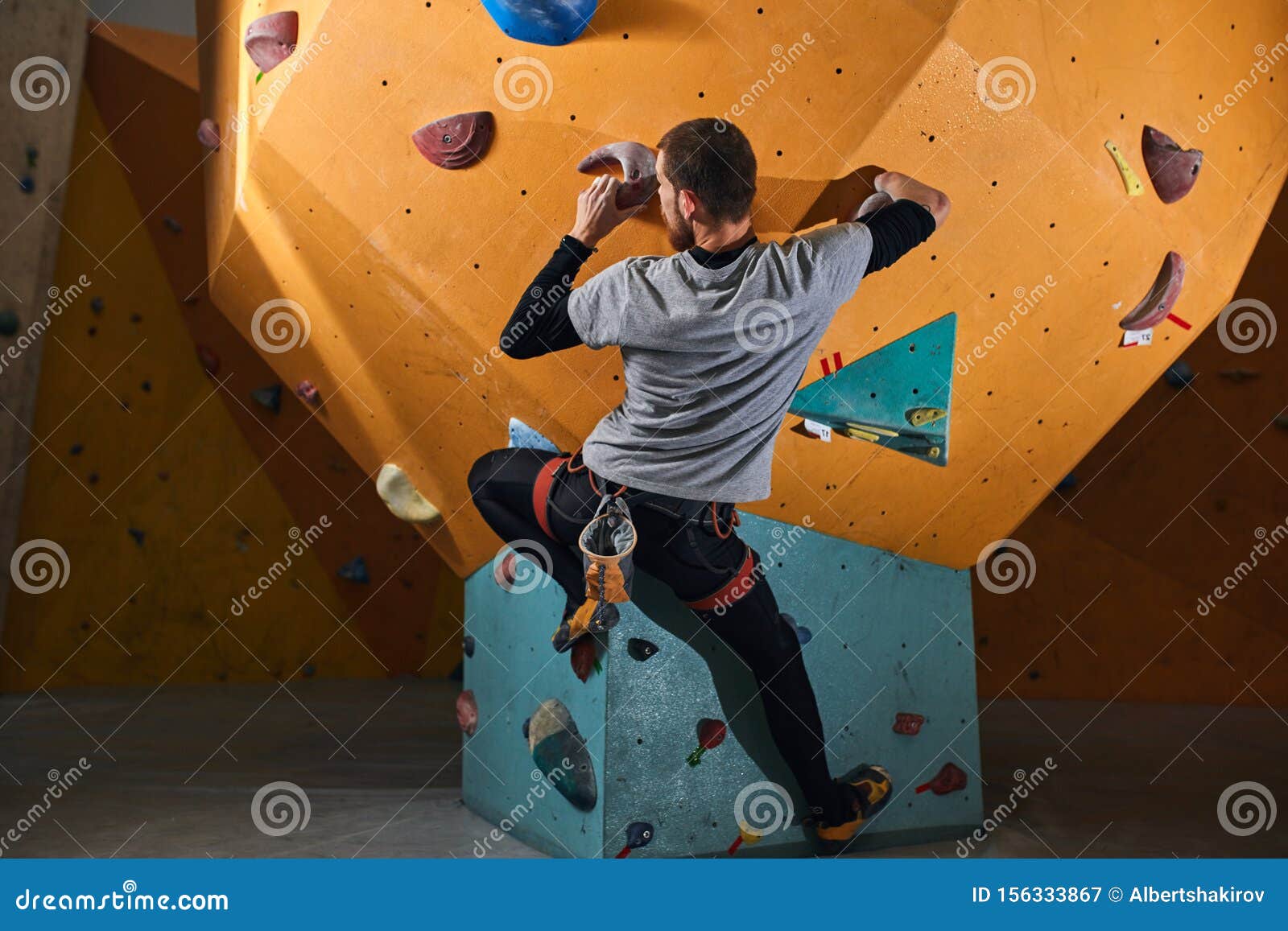 Rear View of Powerful Physically Challenged Boulderer Climbing at Rock ...