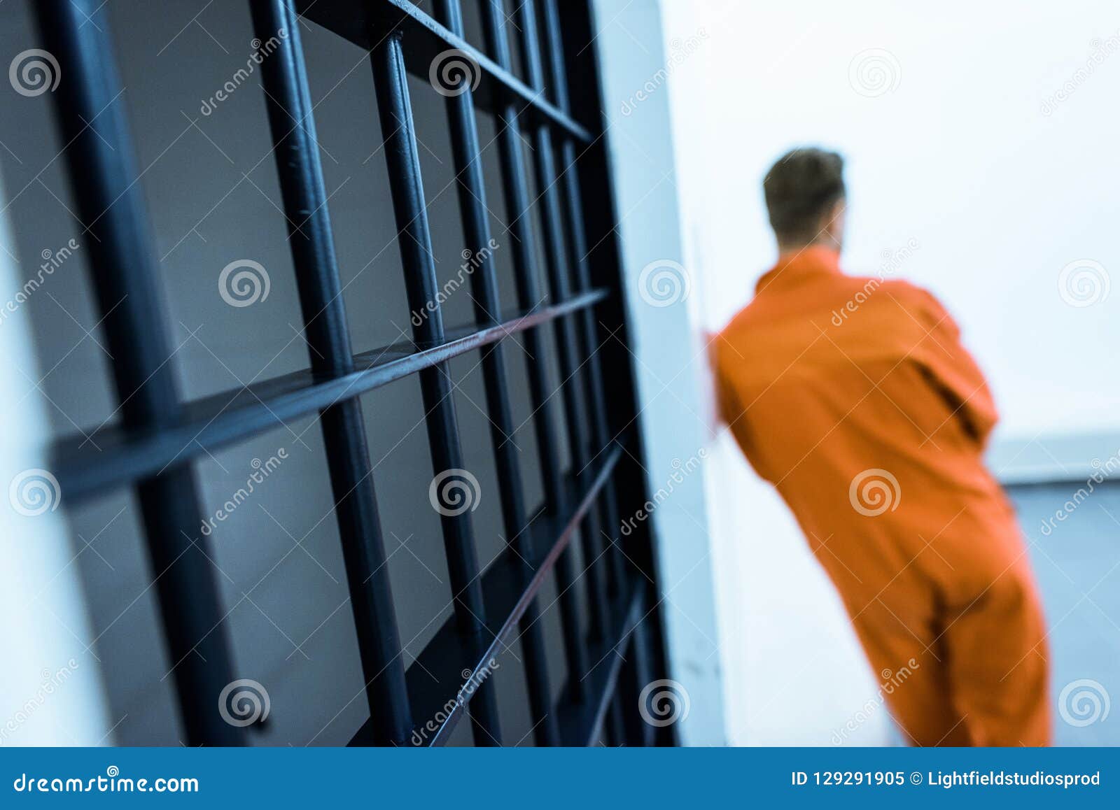 Rear View of Prisoner Leaning on Wall Stock Image - Image of conclusion ...