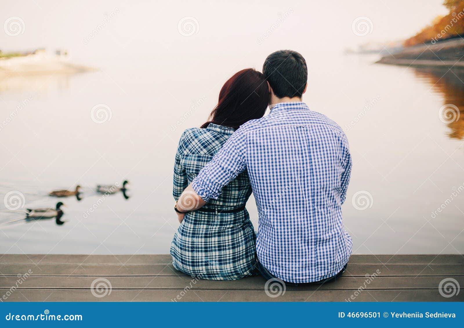 Rear View of a Romantic Young Couple Sitting on Stock Image - Image of ...
