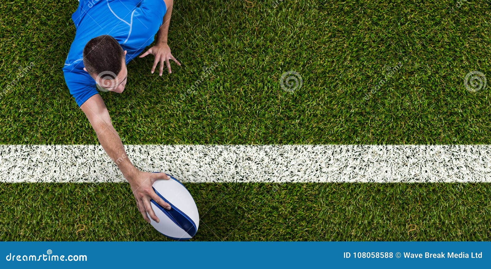 Composite Image of Rear View of Rugby Player Lying in Front with Ball ...