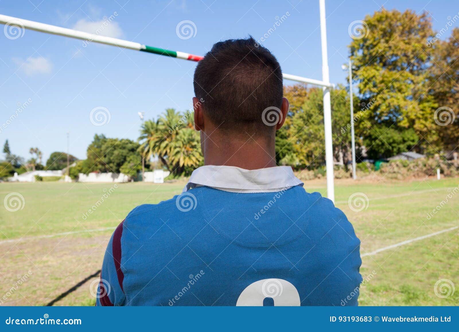 Rear View of Rugby Player Standing Against Blue Sky Stock Image - Image ...