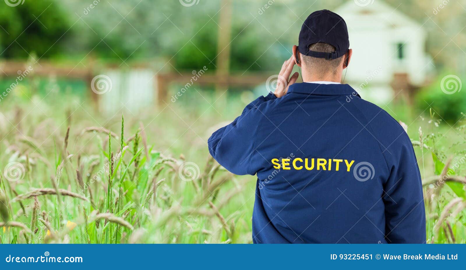 Rear View of Security Guard on Field Stock Image - Image of home, guard ...