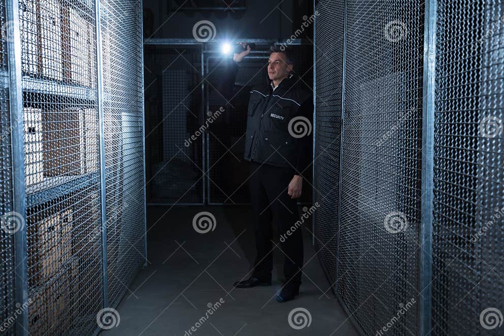 Security Guard Standing in the Warehouse Stock Image - Image of ...