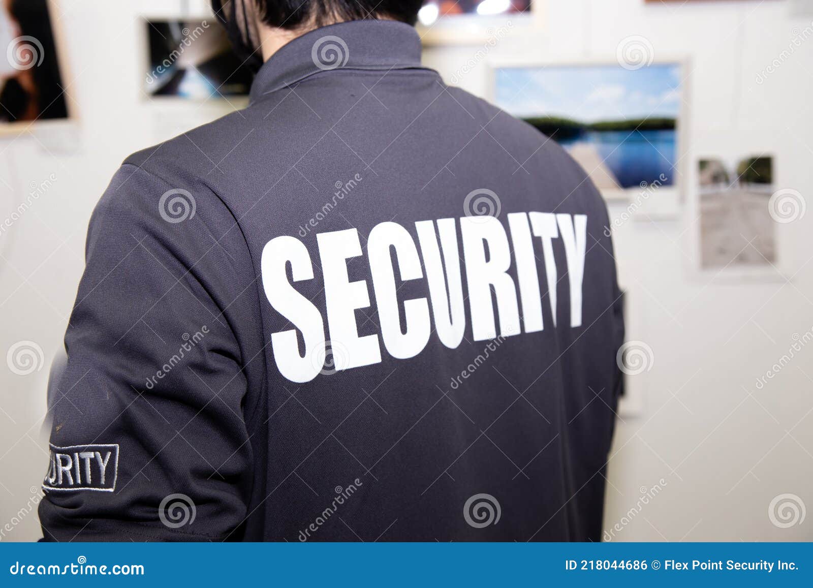 Rear View of Security Guard in Uniform Patrolling in Commercial Mall ...