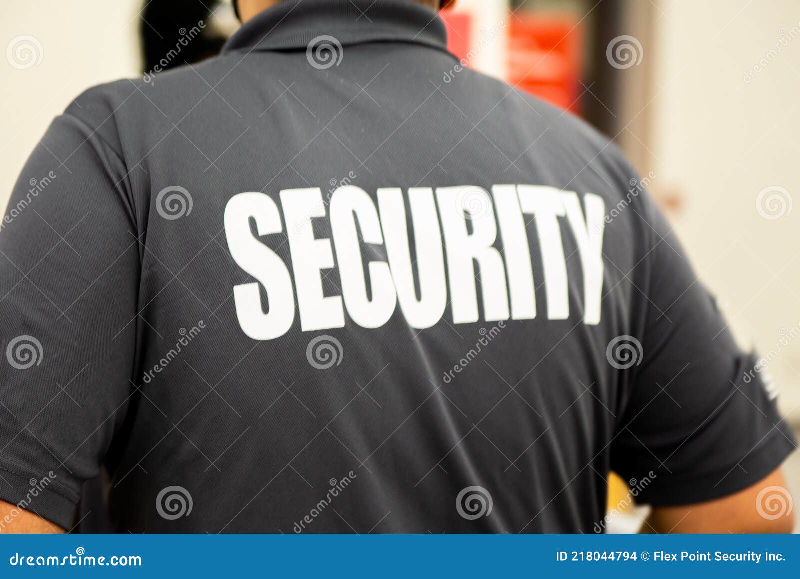 Rear View of Security Guard in Uniform Patrolling in Commercial Mall ...
