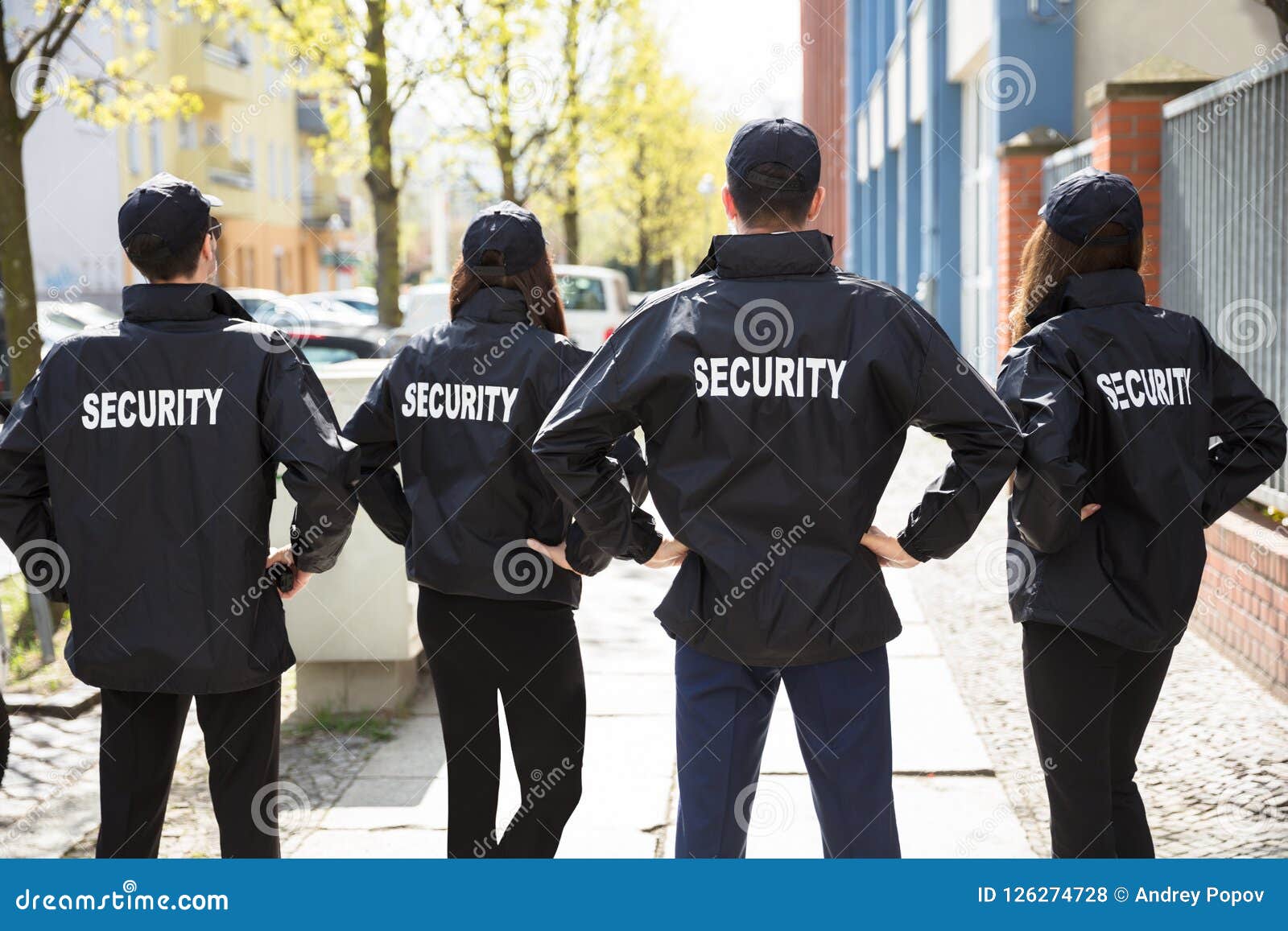 Rear View of Security Guards Standing in a Row Stock Photo - Image of ...