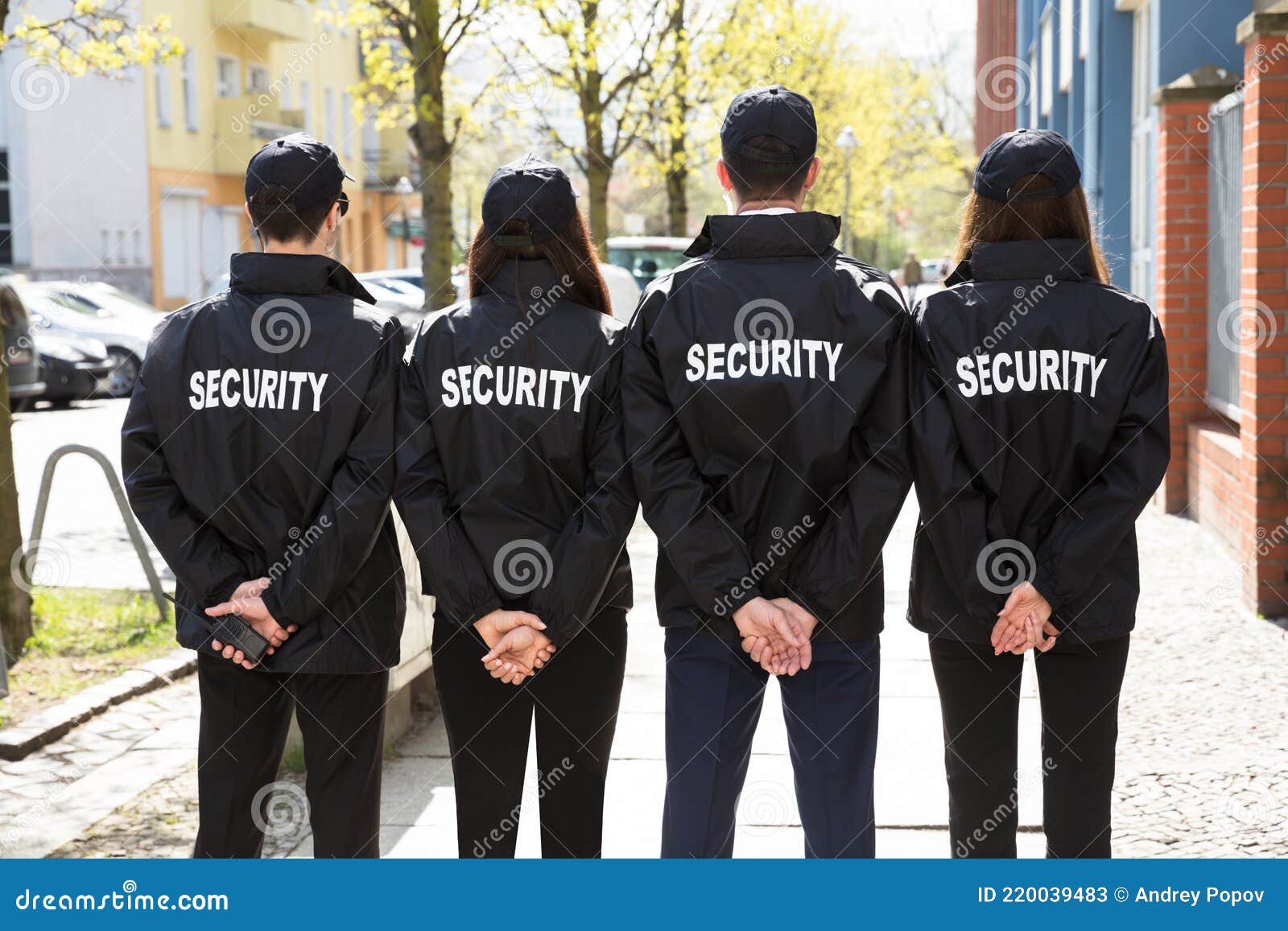 Rear View of Security Guards Standing in a Row Stock Image - Image of ...
