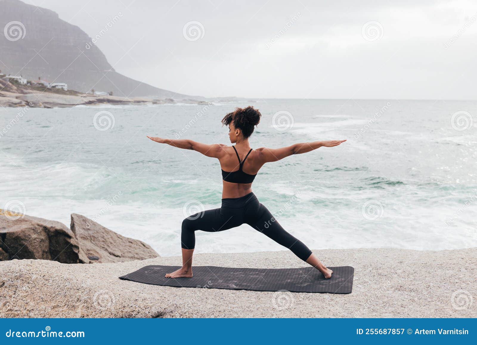 Rear View of Slim Female Practicing Warrior Pose by Ocean Stock Image ...