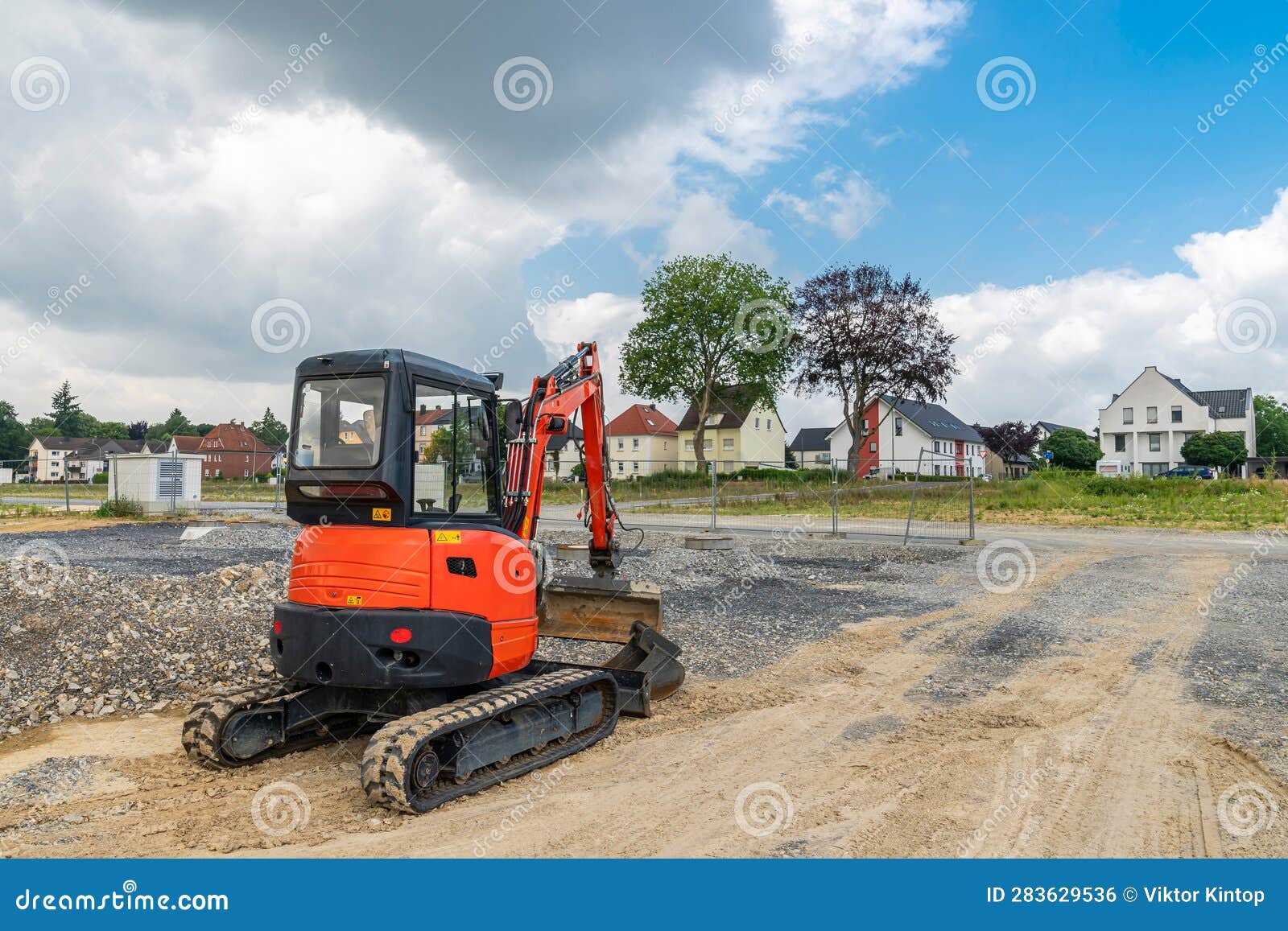 Rear View of a Small Red Excavator Standing on the Edge of a ...