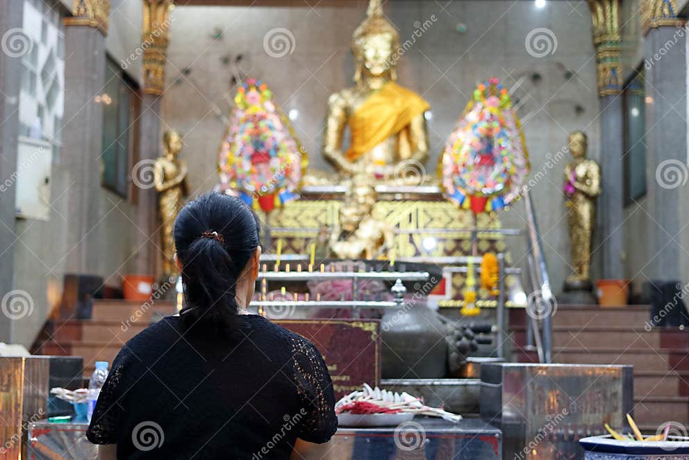 Rear View Of Thai Woman Praying To Buddha In The Temple Editorial Photo