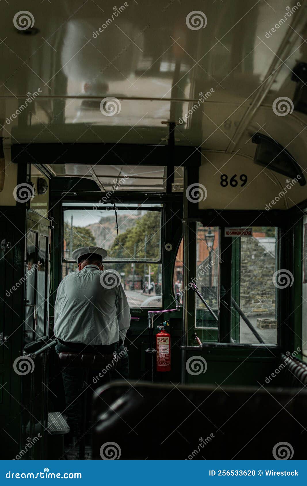 Rear View of a Train Driver Sitting with Outdoors in the Background ...