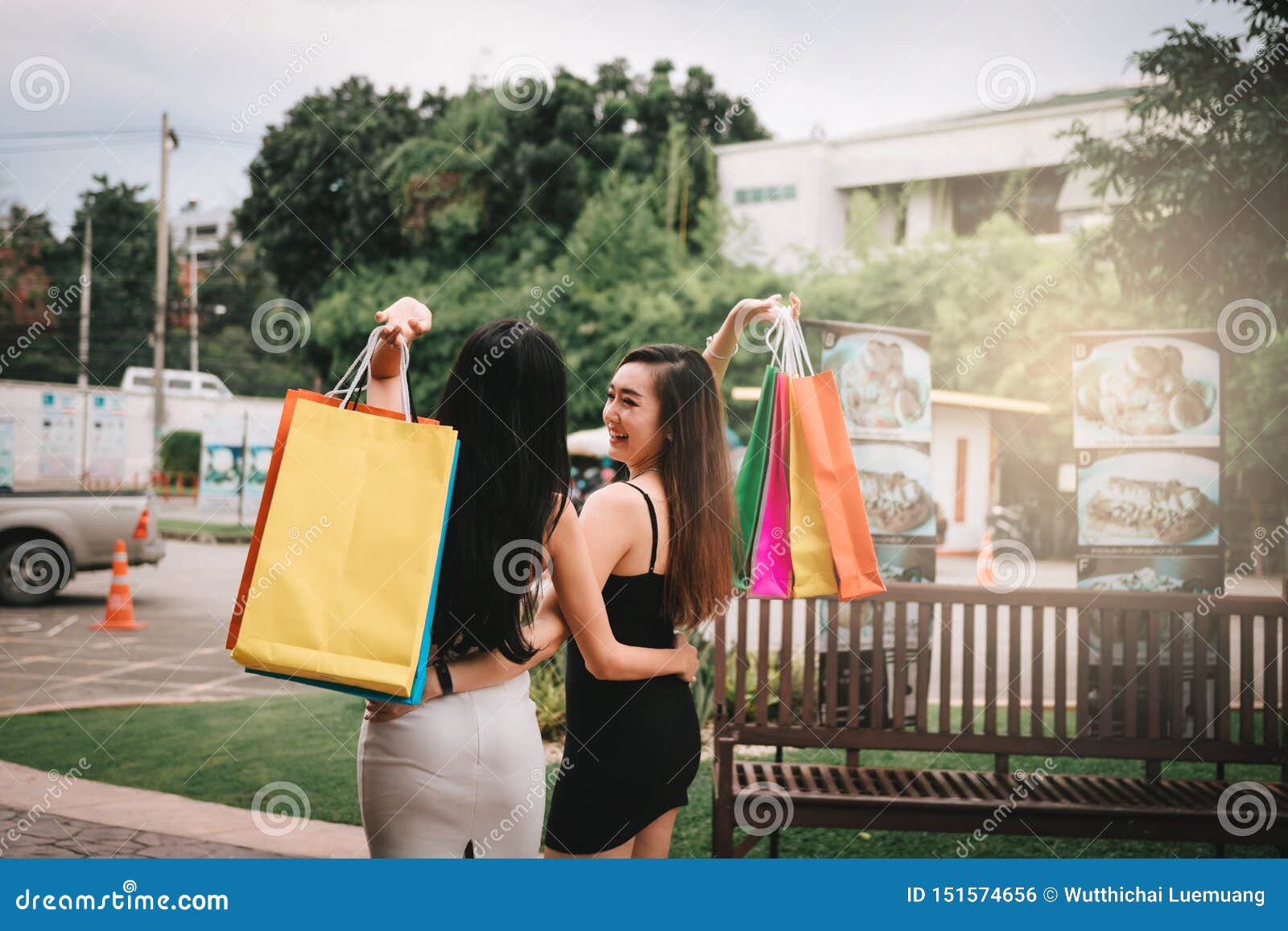 Rear View with Two Beautiful Asian Woman Holding Shopping Bag at ... Rear View with Two Beautiful Asian Woman Holding Shopping Bag at ...