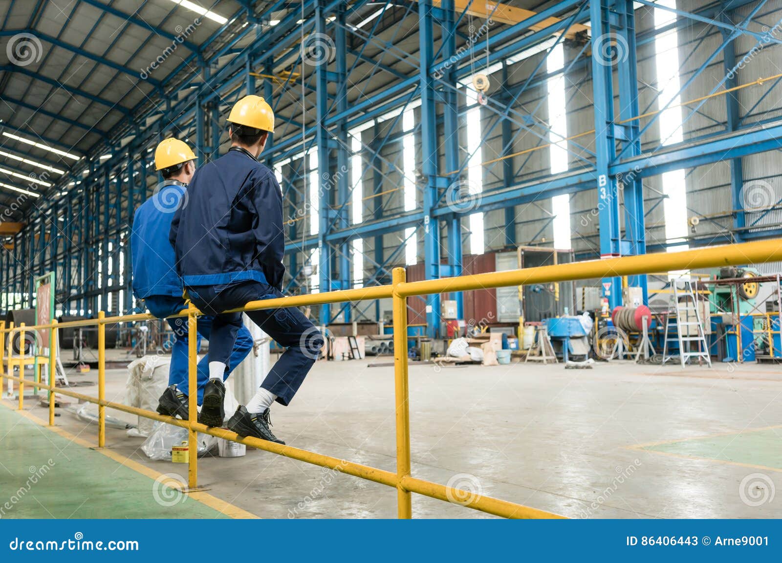 Rear View of Two Blue-collar Workers during Break Stock Image - Image ...