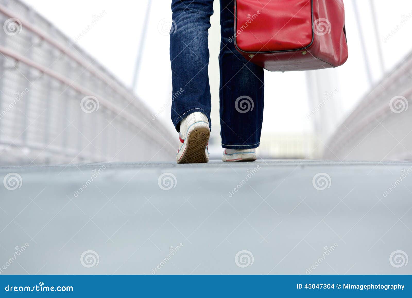 Rear View Walking Feet with Bag Stock Photo - Image of shoes, closeup ...