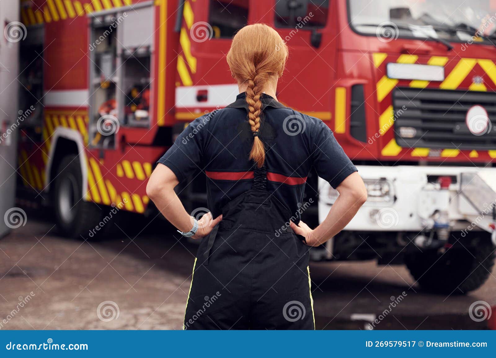 Rear View. Woman Firefighter in Uniform is at Work in Department Stock ...