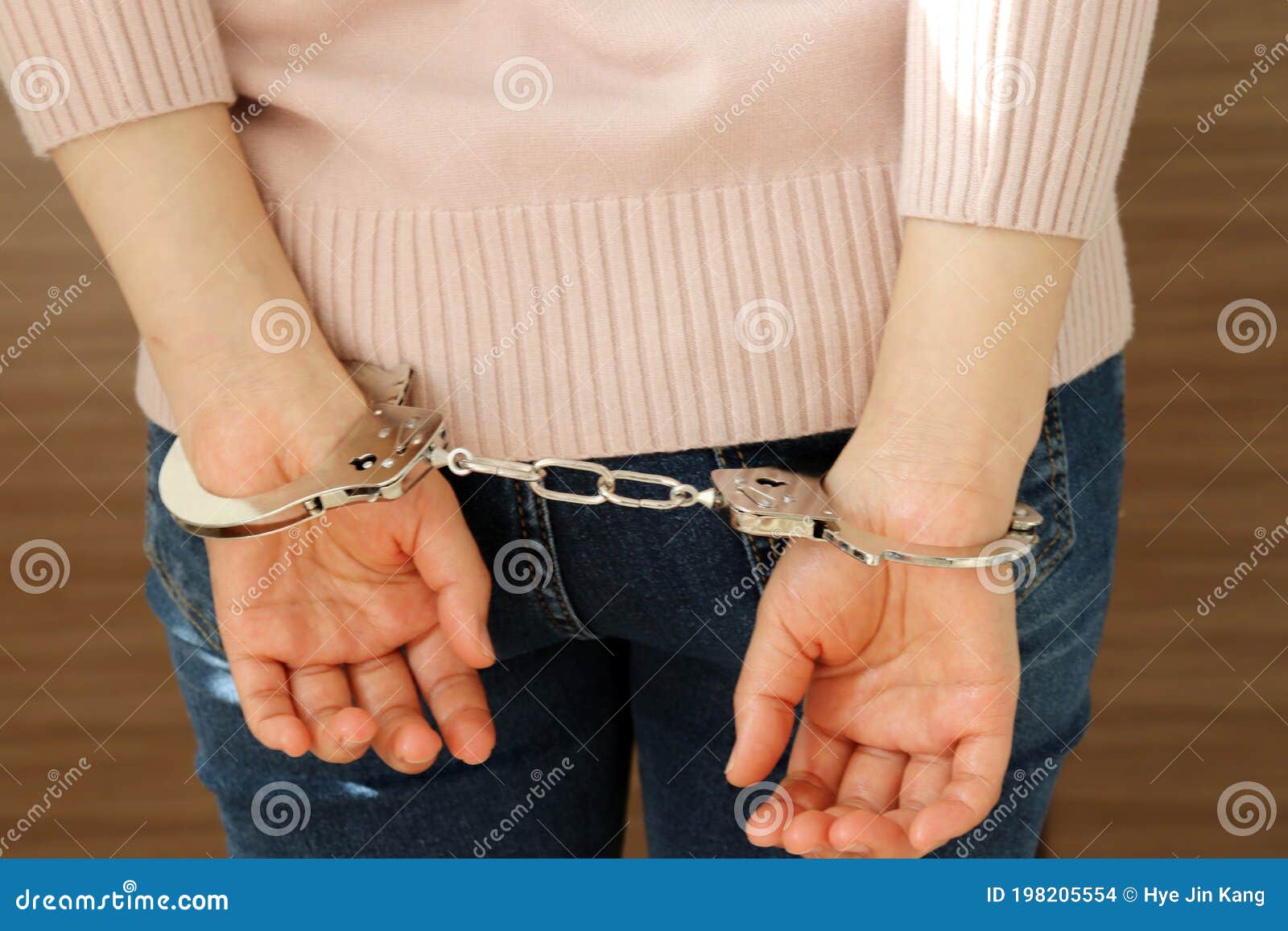 The Back of a Woman with Handcuffs. Stock Photo - Image of increase ...