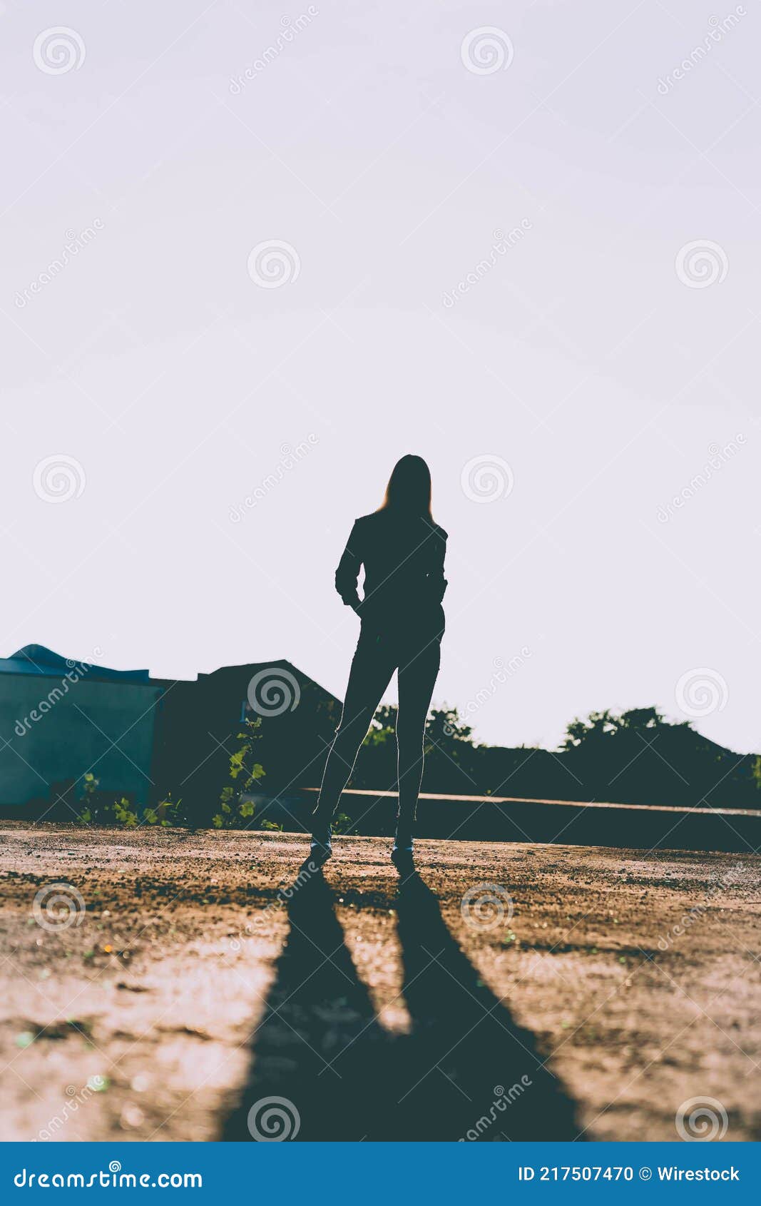 Rear View of a Woman with Shadow on the Ground Under Sunlight Stock ...
