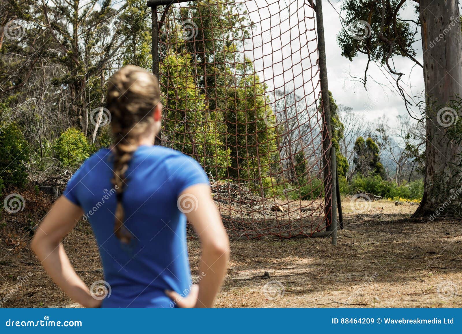 Rear View of Woman Standing with Her Hands on Hip in Boot Camp Stock ...