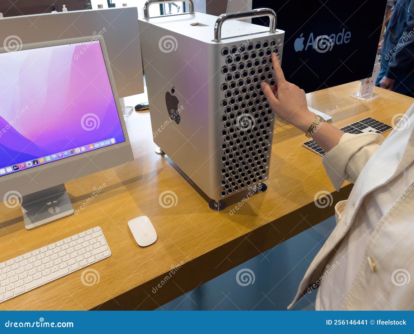 Rear View of Woman Touching the Ventilation Holes of the Mac Pro ...