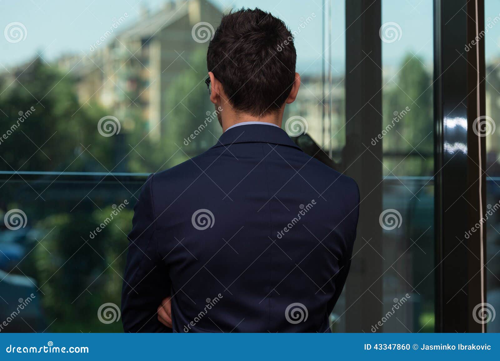 Rear View of Young Businessman in Office Stock Photo - Image of people ...