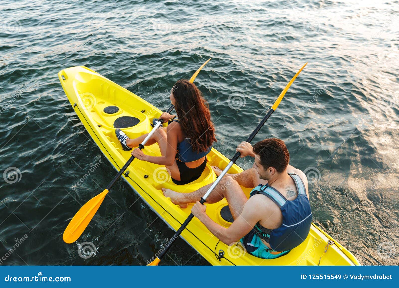 Rear View of a Young Couple Kayaking on Lake Stock Image - Image of ...