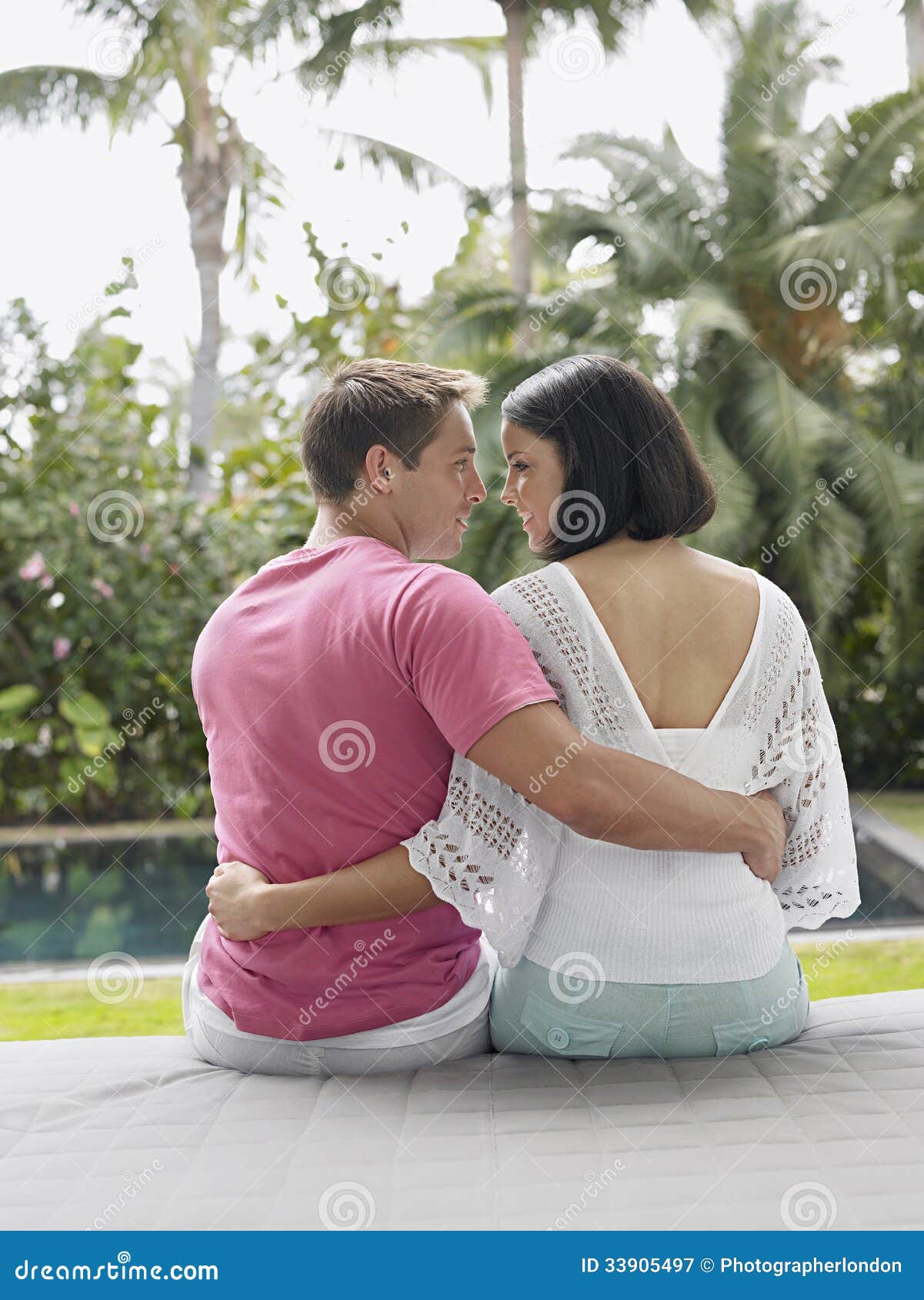 Rear View of Young Couple Sitting in Garden Stock Image - Image of ...