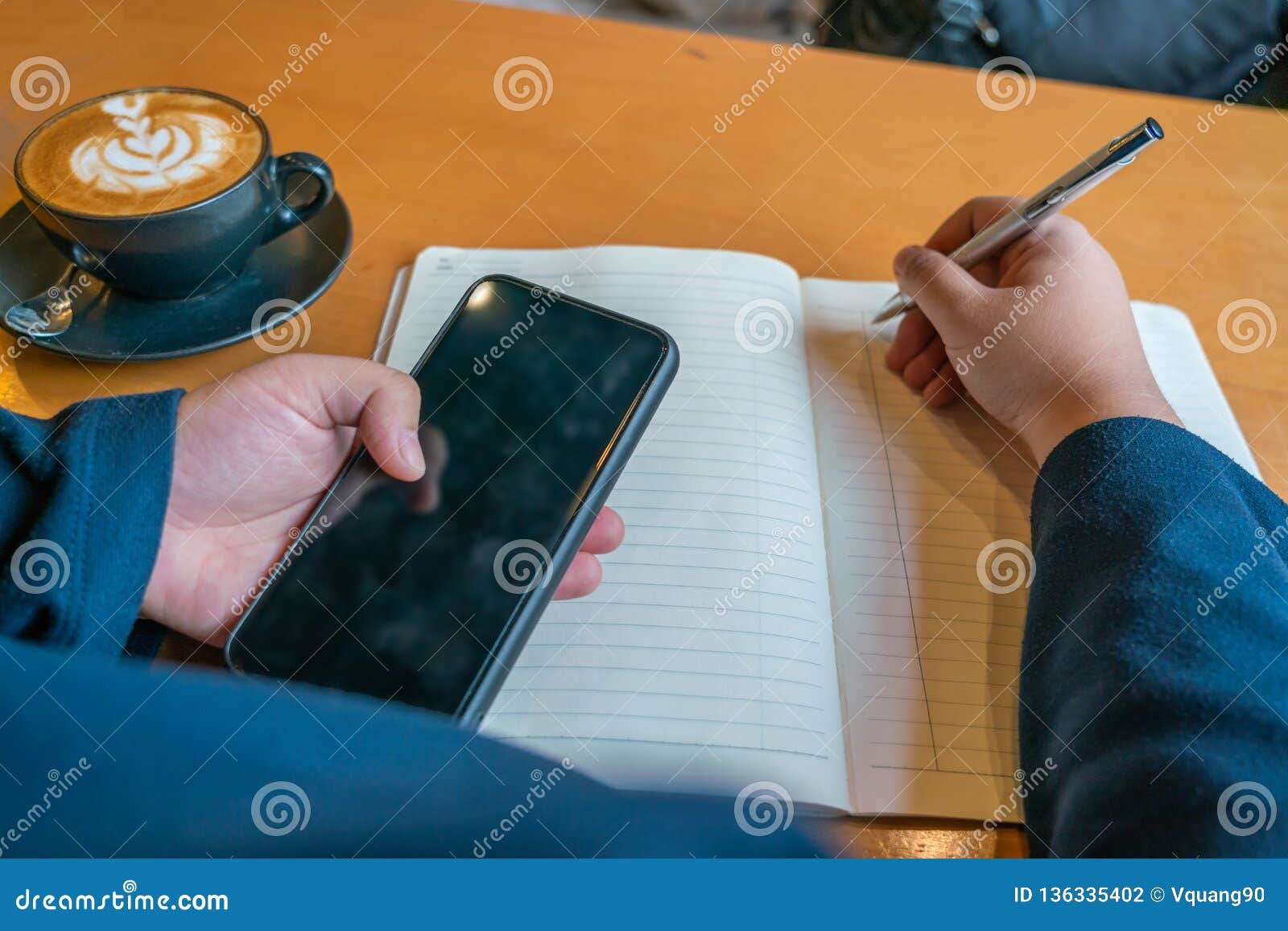 Writing Notes and Using Smartphone Stock Photo - Image of books ...