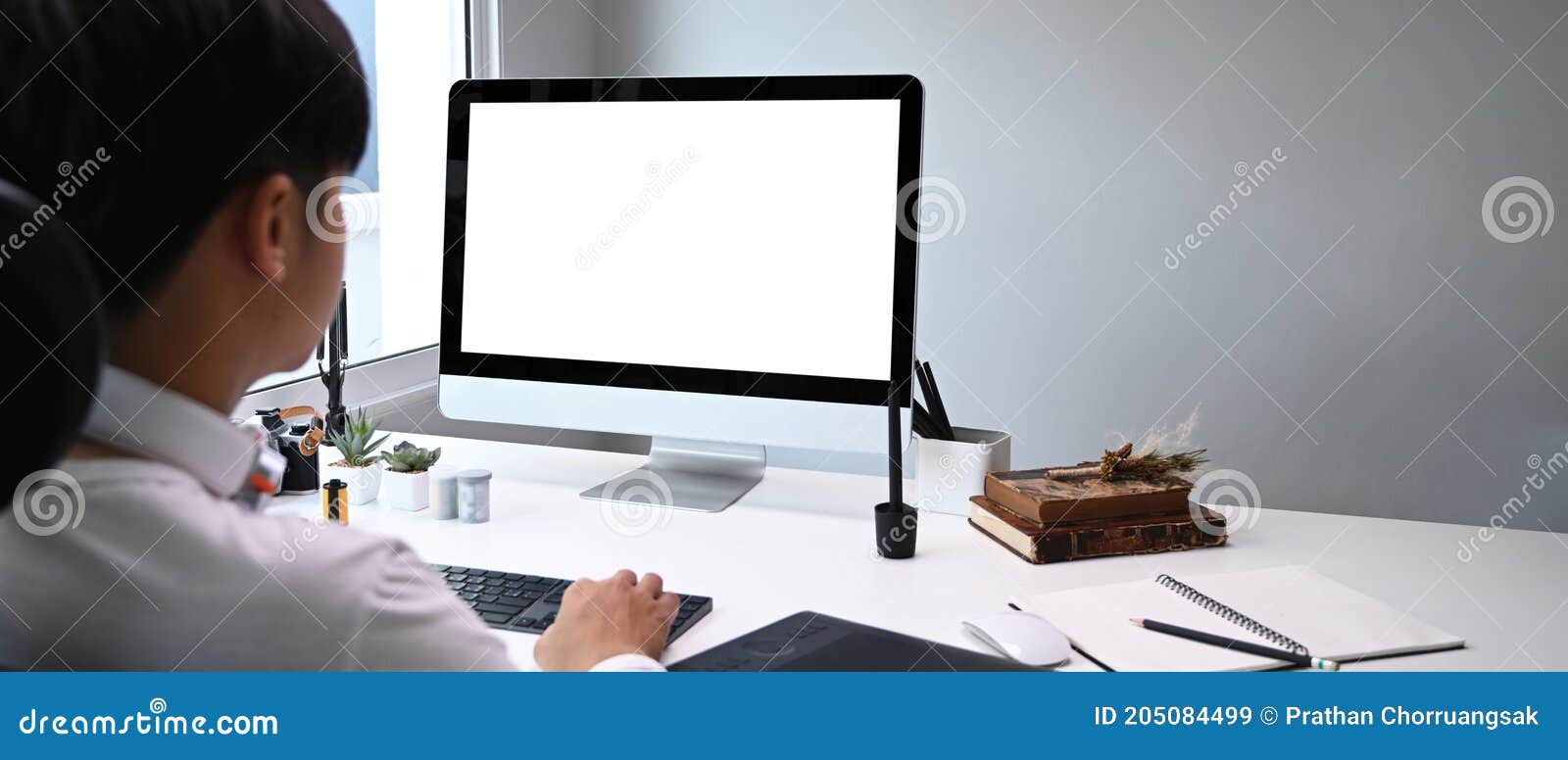 Rear View of Young Graphic Designer Sitting at His Workspace in Front ...