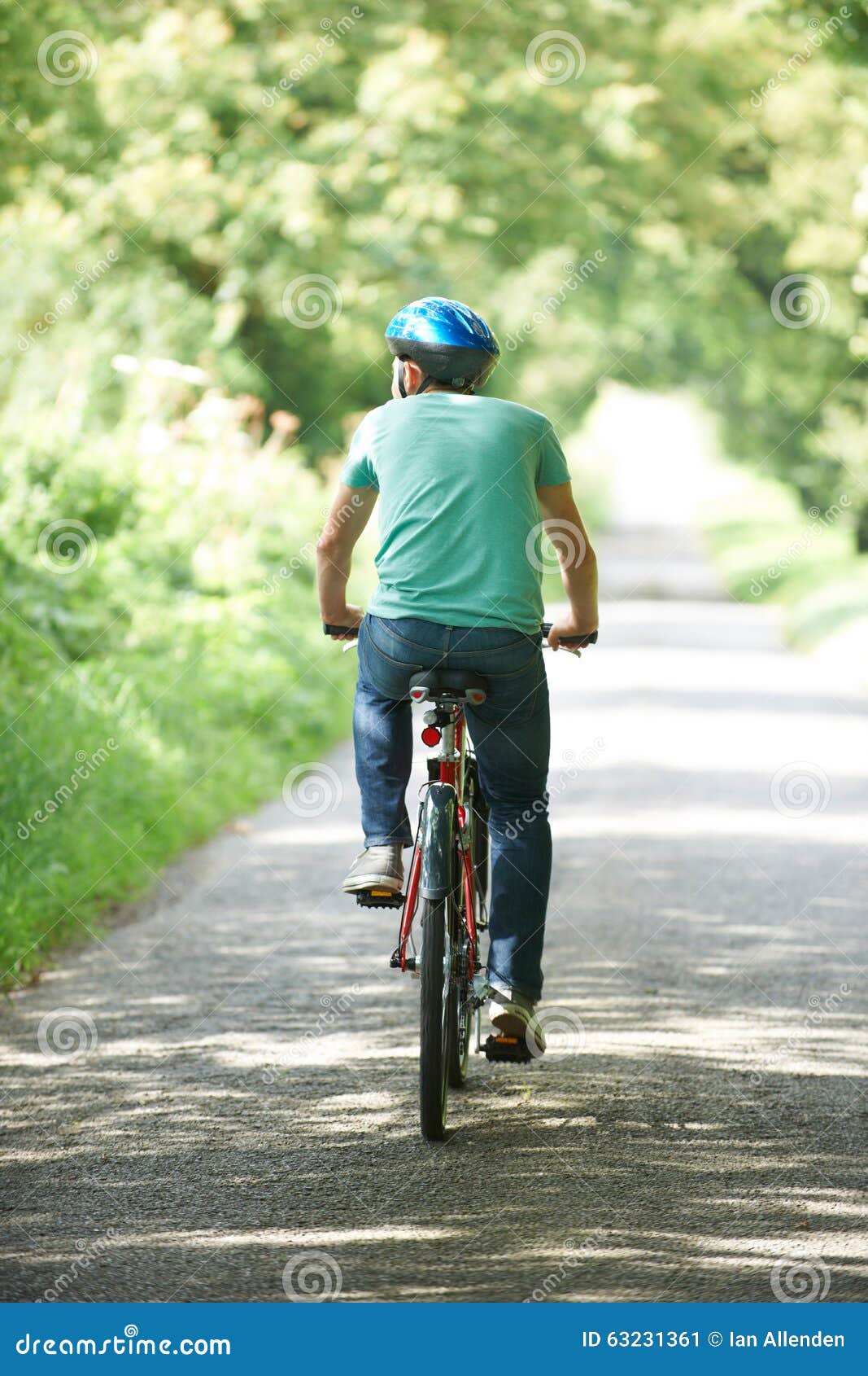 Rear View of Young Man Enjoying Cycle Ride in Countryside Stock Image ...