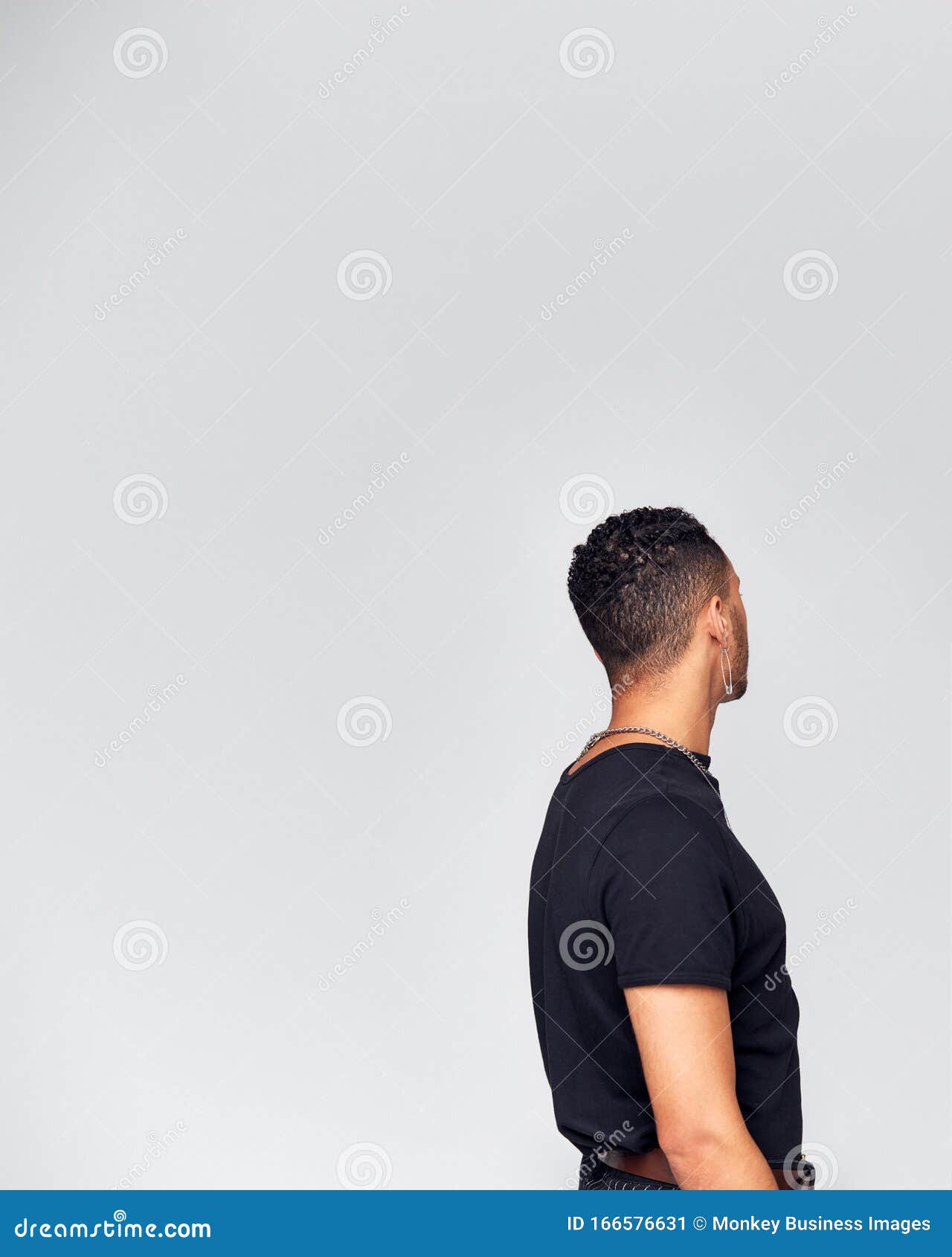 Rear View of Young Man Looking Away from Camera in Studio Stock Image ...