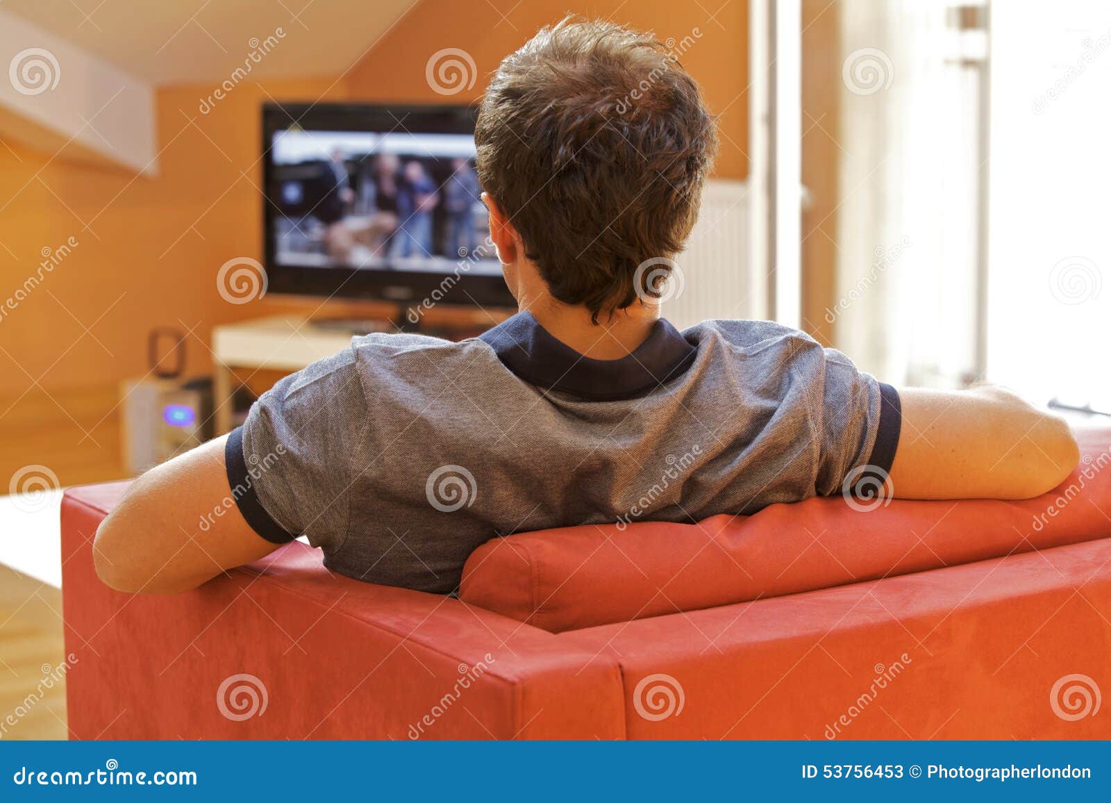 Rear View of Young Man Watching Television Stock Image - Image of ...