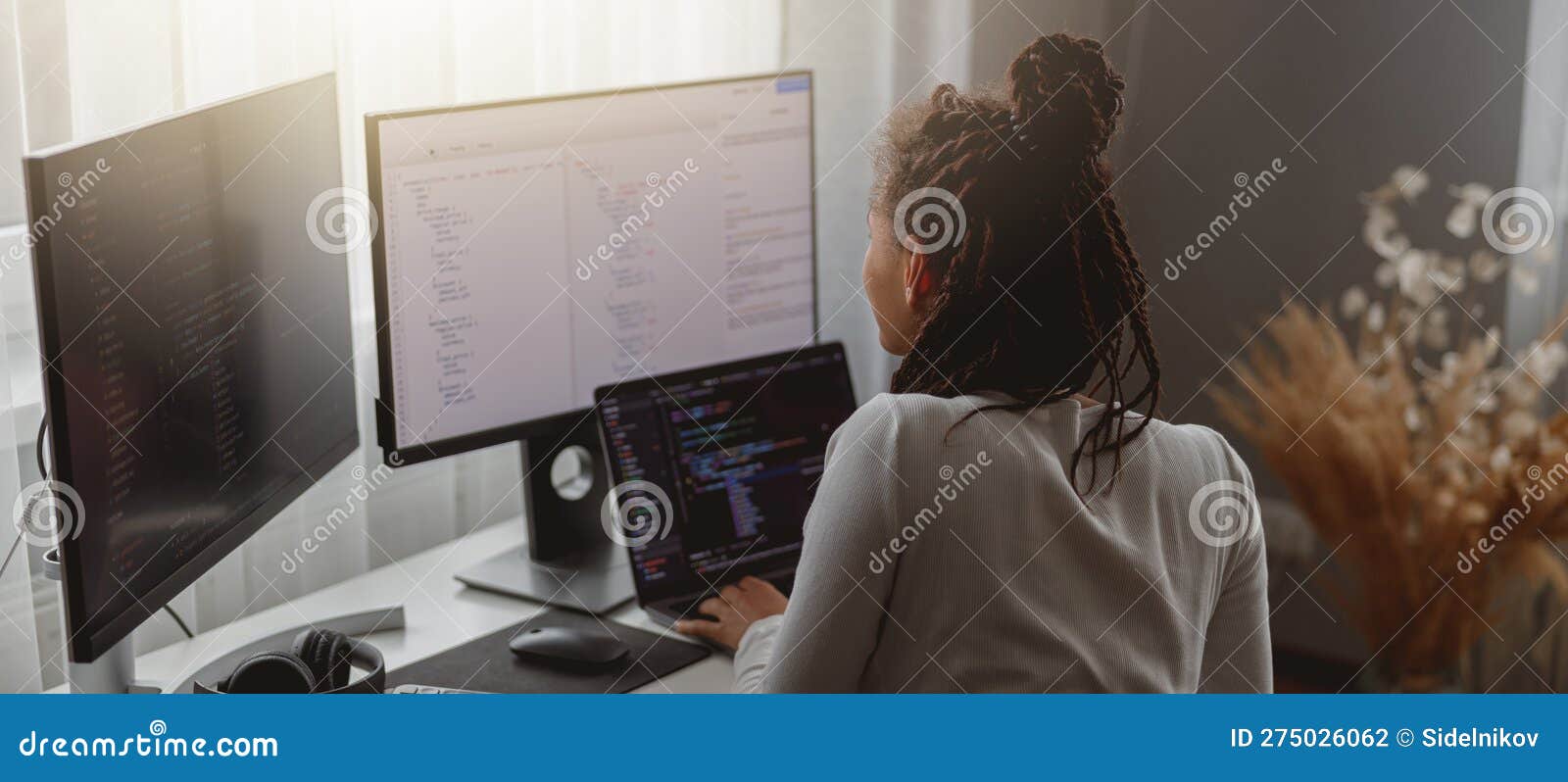Rear of Young Woman Looking at Computer Screen while Working ...