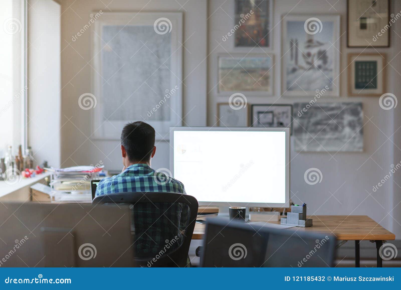Designer Working Alone at a Desk in an Office Stock Photo - Image of ...