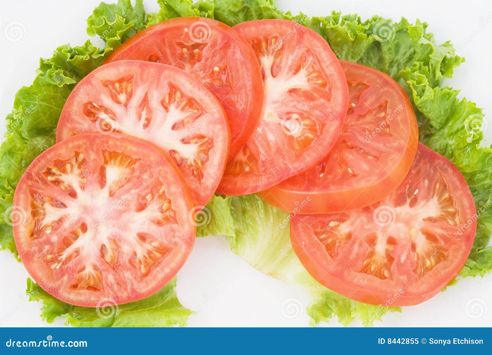 Rebanadas Del Tomate En Verde Imagen de archivo - Imagen de fondo ...
