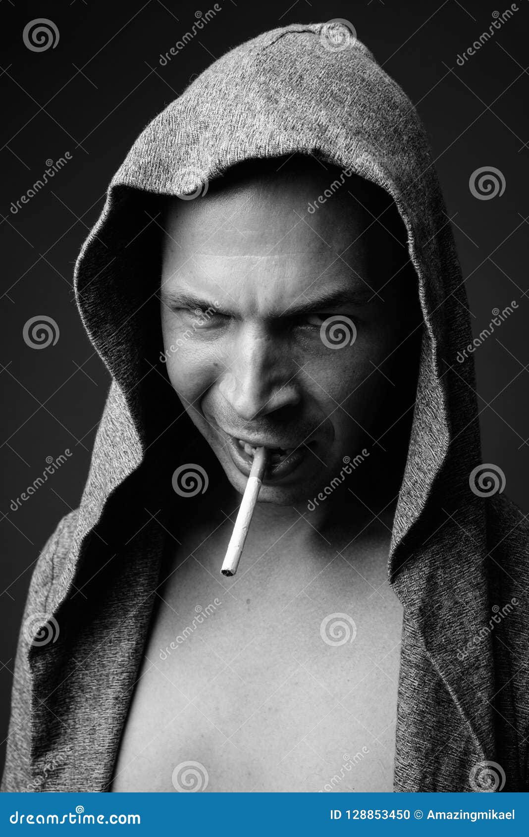 Rebellious Man Against Black Background in Black and White Stock Photo ...