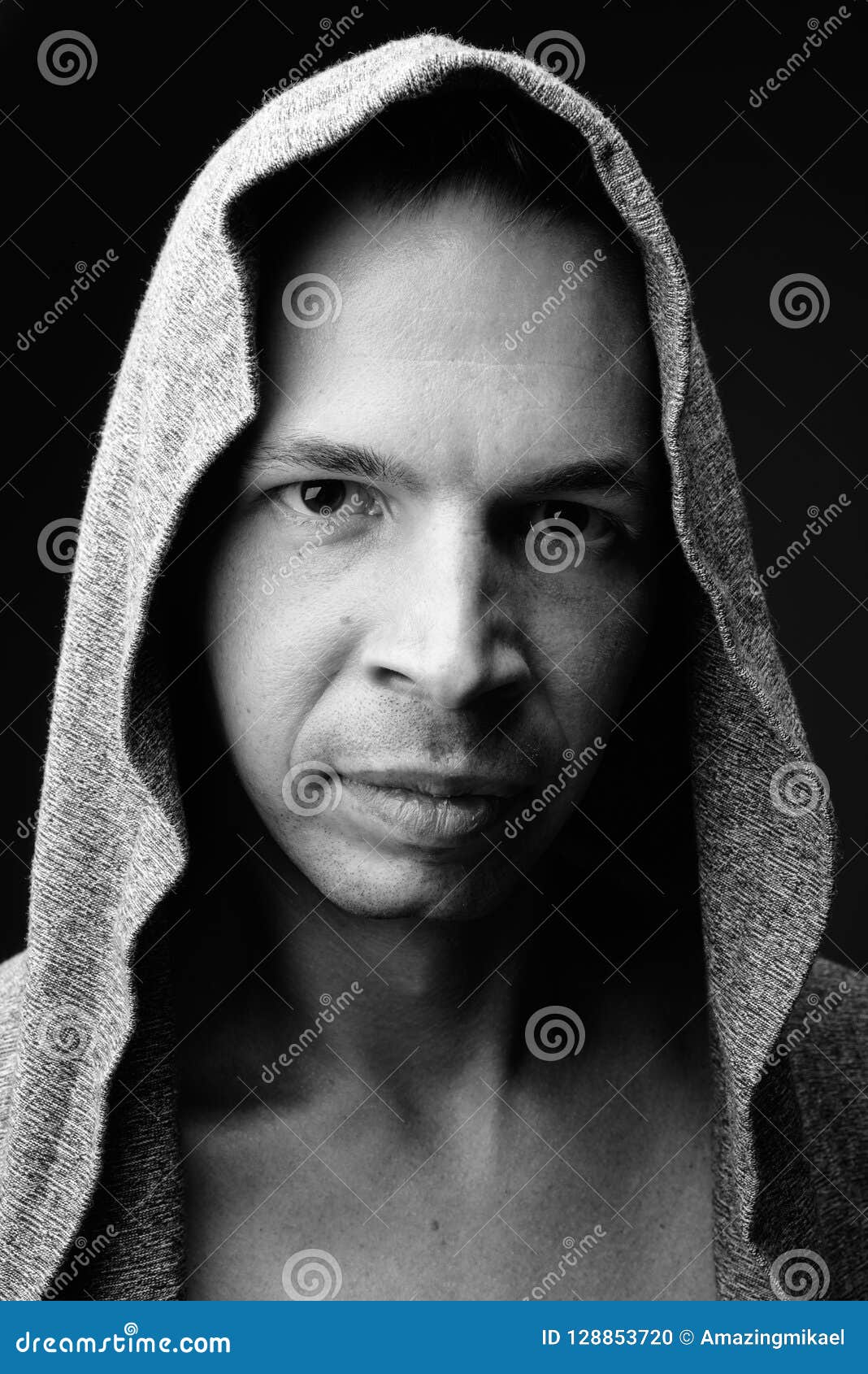 Rebellious Man Against Black Background in Black and White Stock Photo ...