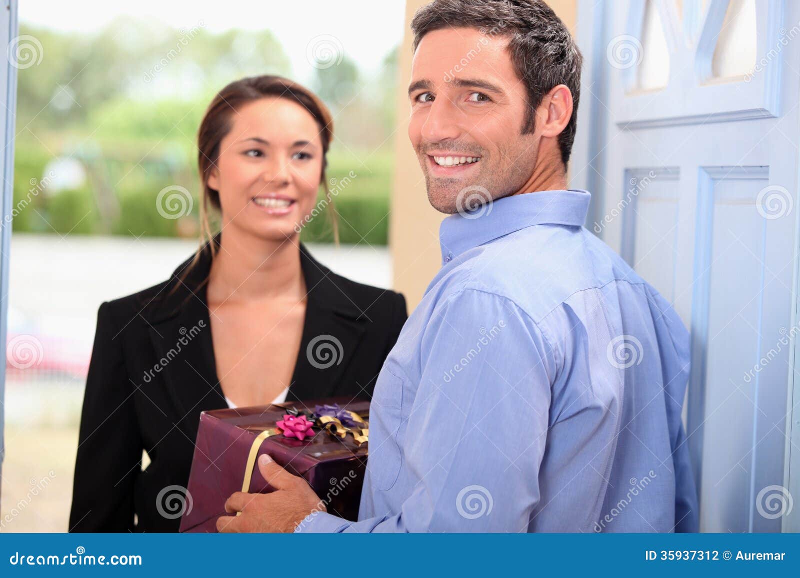 Receiving a Gift from His Wife Stock Photo - Image of gleeful, glad ...