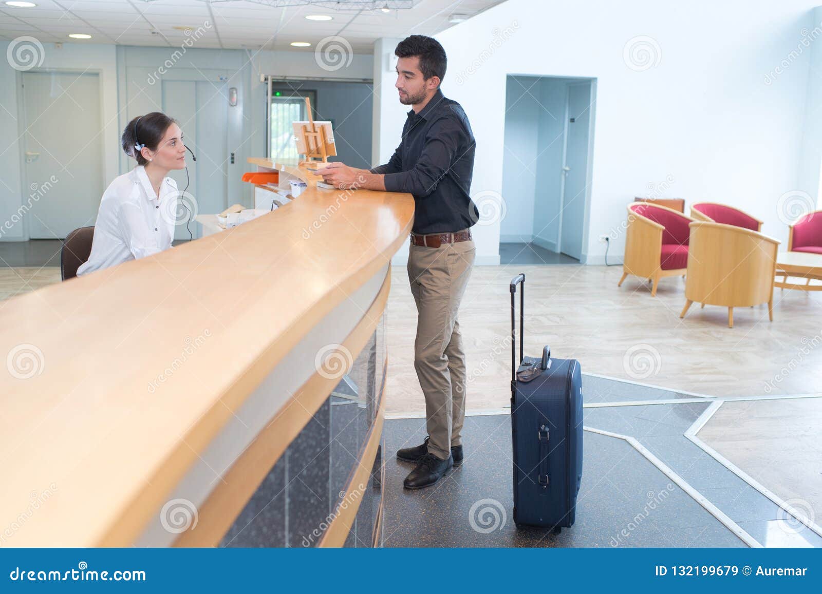 In the reception area stock image. Image of receptionist - 132199679