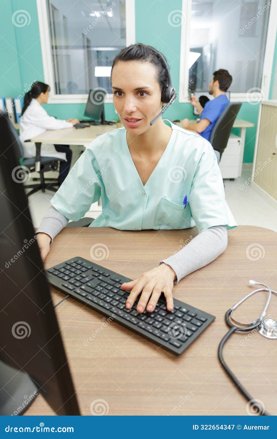 Reception Desk Nurse on Duty Stock Image - Image of pickingup, nurse ...