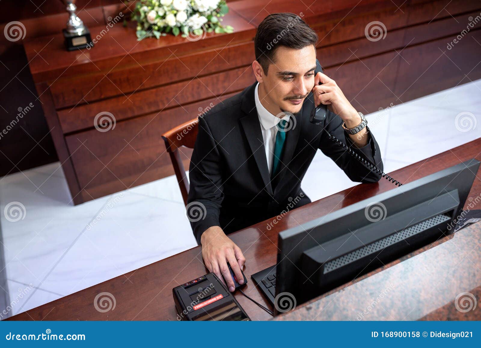 Receptionist in Black Suit Sitting and Working Stock Photo - Image of ...