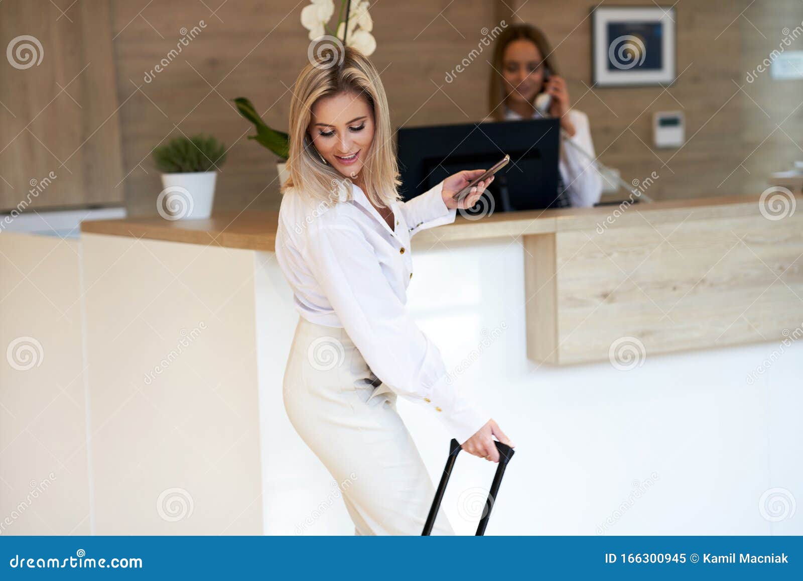 Receptionist and Businesswoman at Hotel Front Desk Stock Image - Image ...