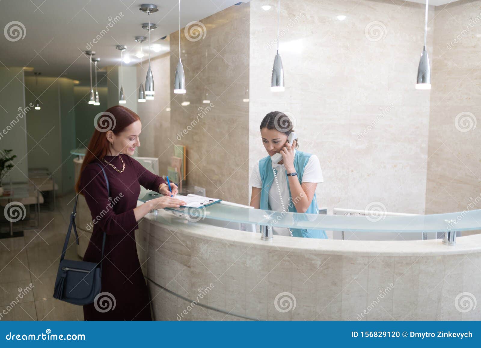 Receptionist Calling the Dentist To Inform about Client Stock Photo ...